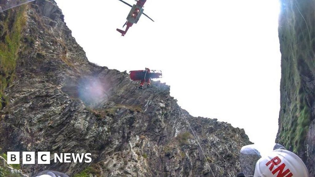 Woman airlifted to hospital in rescue operation after cliff fall - BBC News