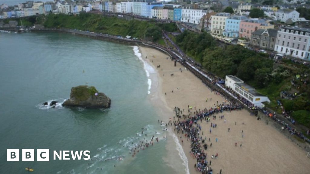 Ironman Wales: 1,800 take part in Tenby triathlon - BBC News