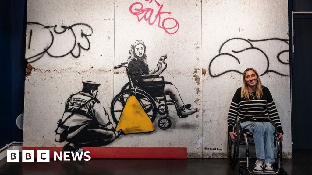 Mural shown at site of disabled parking space row