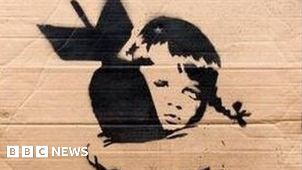'Banksy' cardboard protest placard up for auction - BBC News