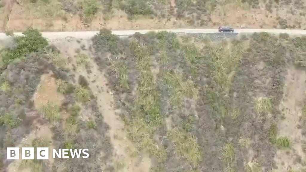 Drone footage of California cliff crash released - BBC News