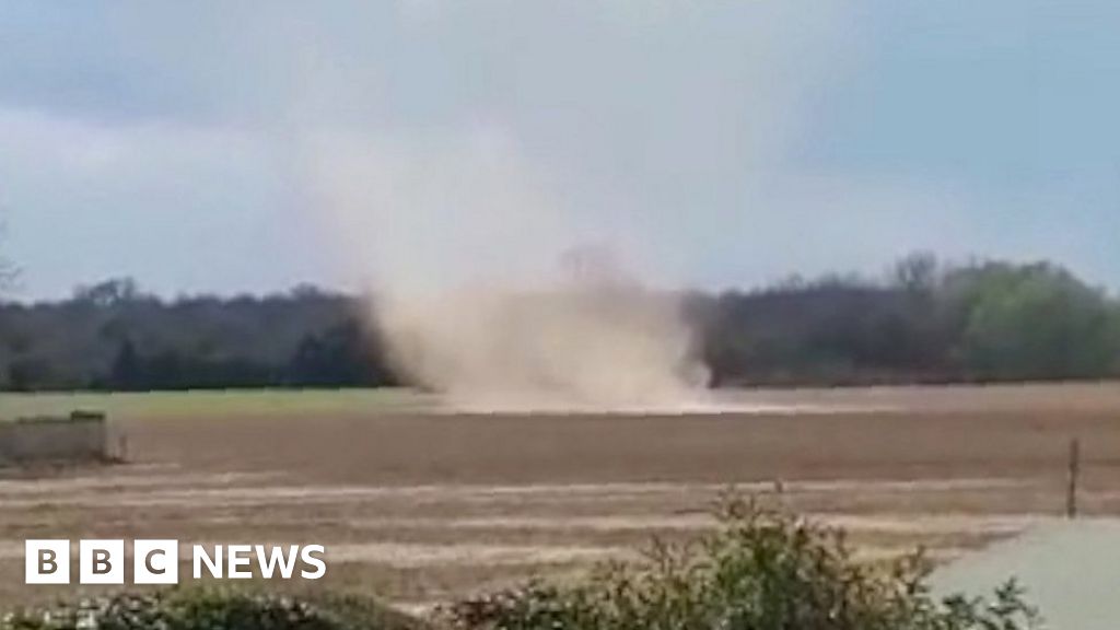 Dust devil vortex spins across Suffolk countryside - BBC News
