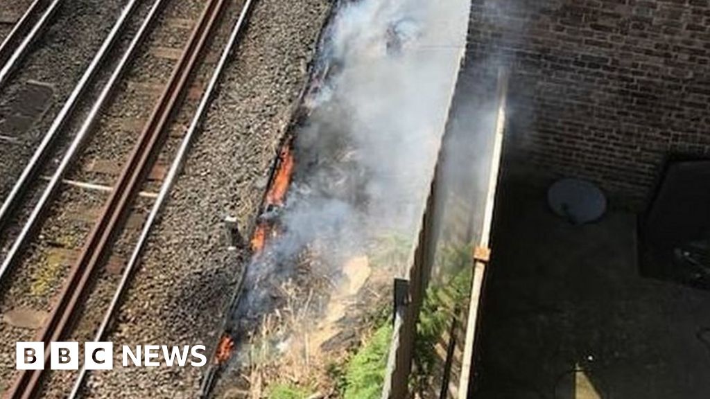 London Euston trains halted by trackside fire - BBC News