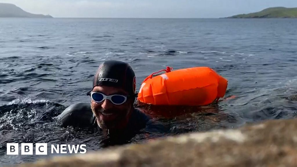'Swimming to work helps my mental health' - BBC News