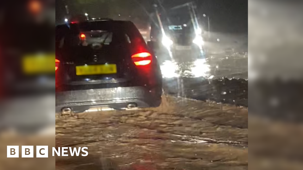 Wales weather: Roads and homes flooded as heavy rain hits - BBC News