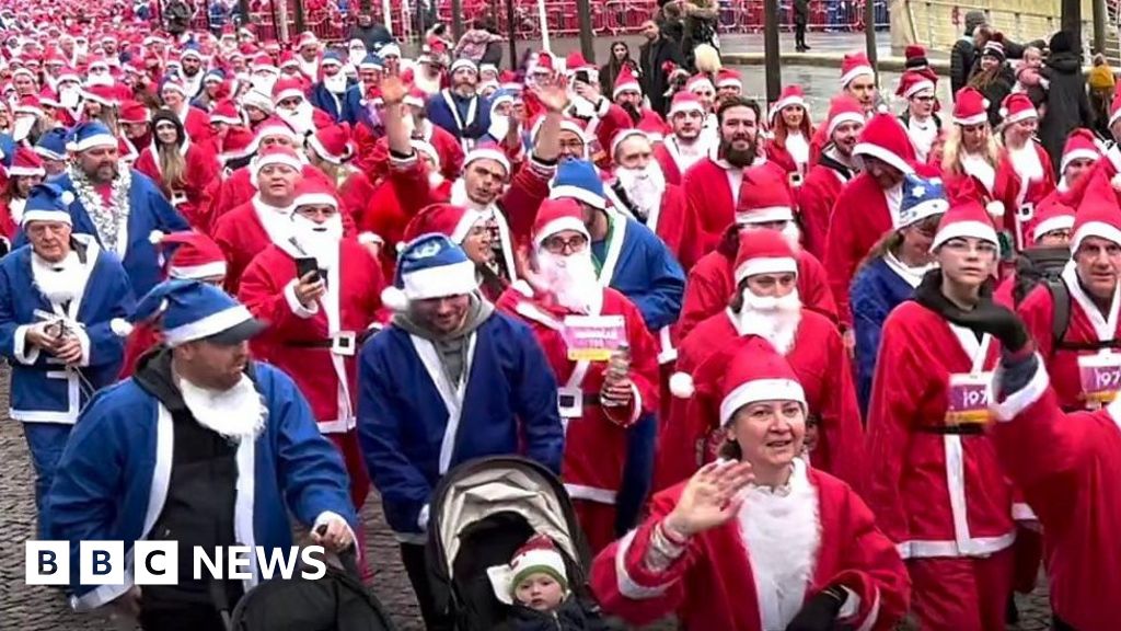 Liverpool Santa Dash: Thousands join charity run - BBC News