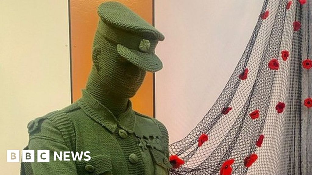 Life-sized remembrance soldier created by knitters - BBC News