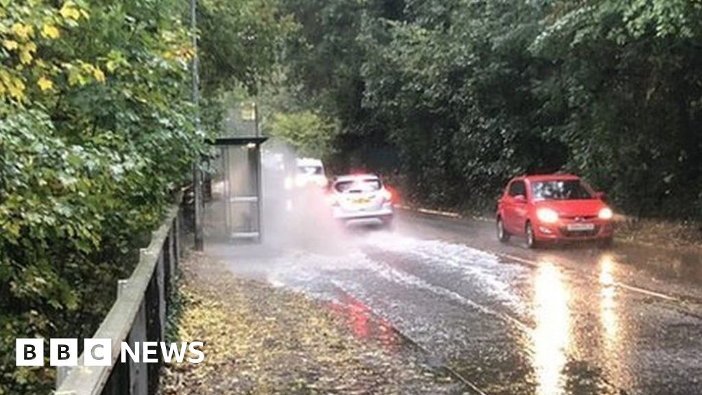 Five rescued from cars trapped in Carmarthenshire flood - BBC News