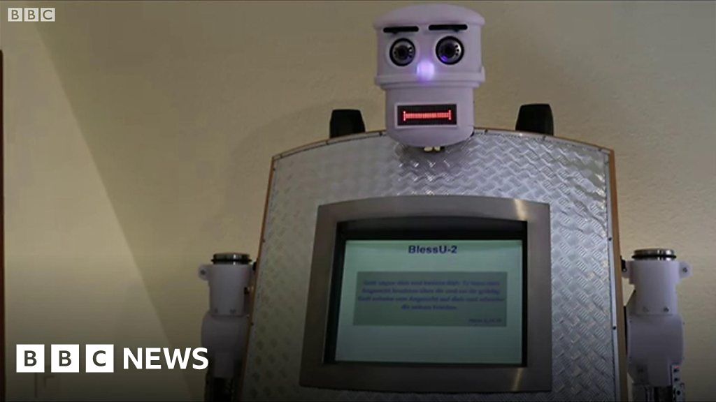 Robotic reverend blesses worshippers in eight languages - BBC News