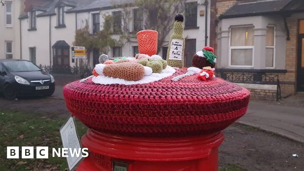 Knitted Christmas hats appear on post boxes in Caerleon
