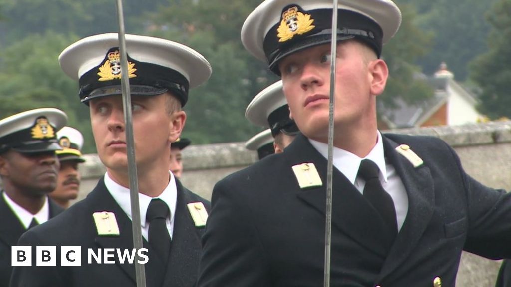 Families at Royal Britannia Naval College passing-out parade - BBC News