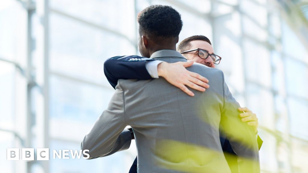 Why you shouldn't hug your colleagues - BBC News