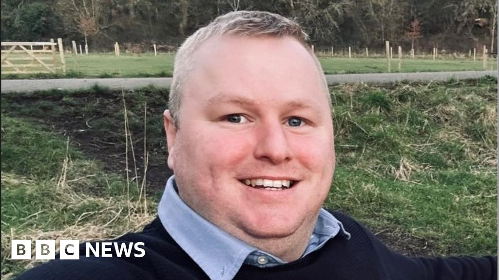 Bridgend: Wife begged ex-councillor to end stab attack - court - BBC News