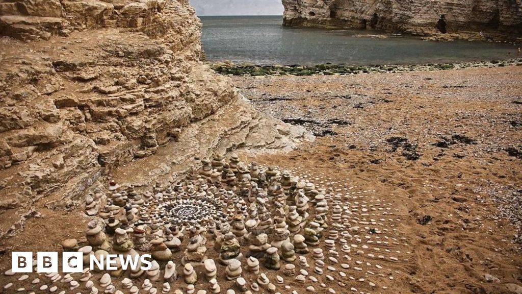 Artist unveils latest pebble beach work in Flamborough