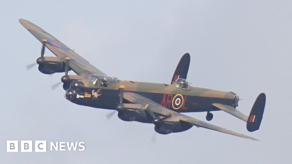 Lancaster bomber flypast for Armed Forces Day - BBC News