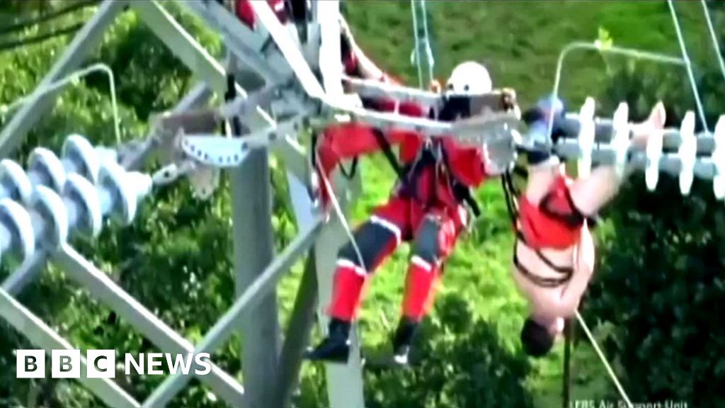 Lancashire firefighters honoured for rescuing man from pylon - BBC News