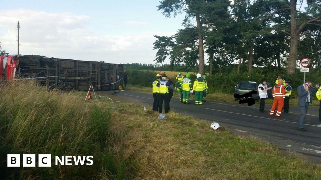 Nine pupils injured as Oundle school bus tips over - BBC News