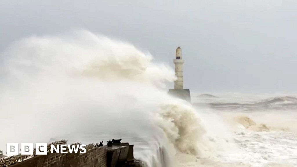 Waves crash against Torry Battery in Aberdeen - BBC News