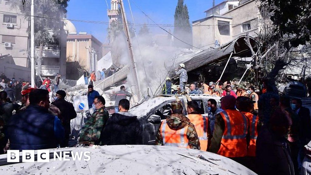 Air strike flattens building in Syrian capital