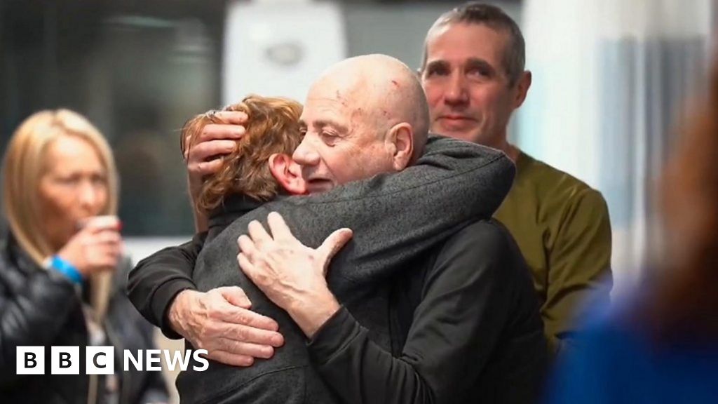 Emotional moment Israeli hostages hug with reunited family - BBC News