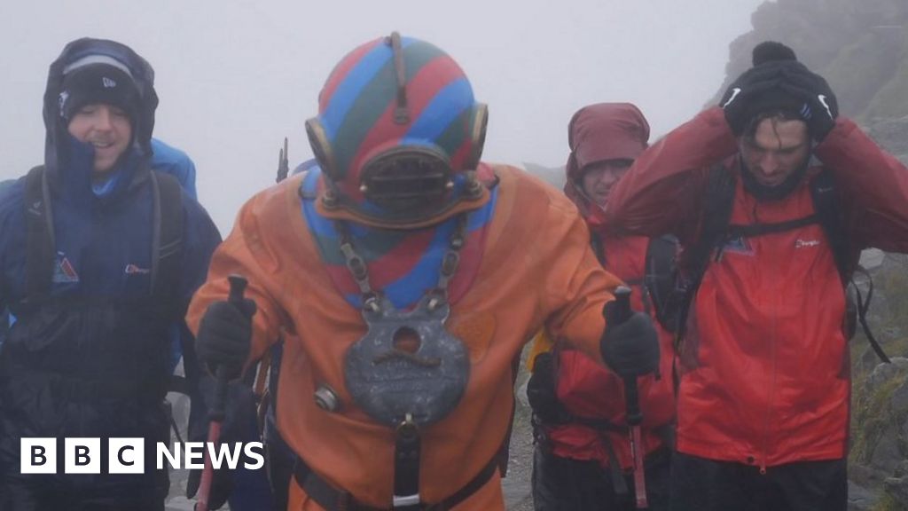 Snowdon: Lloyd Scott reaches peak in diving suit - BBC News