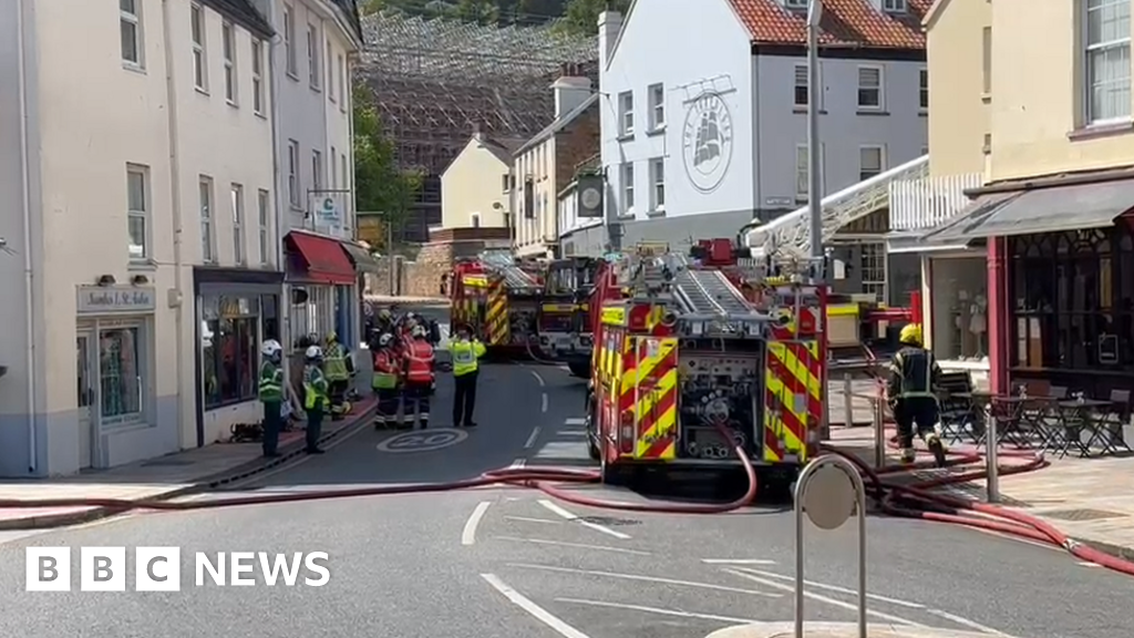 Fire crews tackle large blaze in Jersey building - BBC News