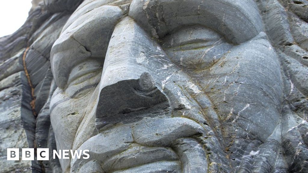 Tintagel's Merlin carving suffers nose damage - BBC News