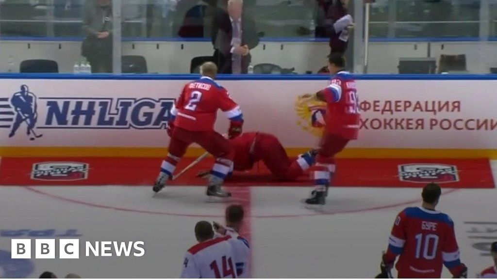 Russia's President Putin falls on ice after hockey match