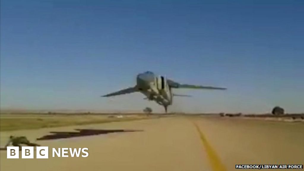 Libya jet skims heads in very low fly-by - BBC News