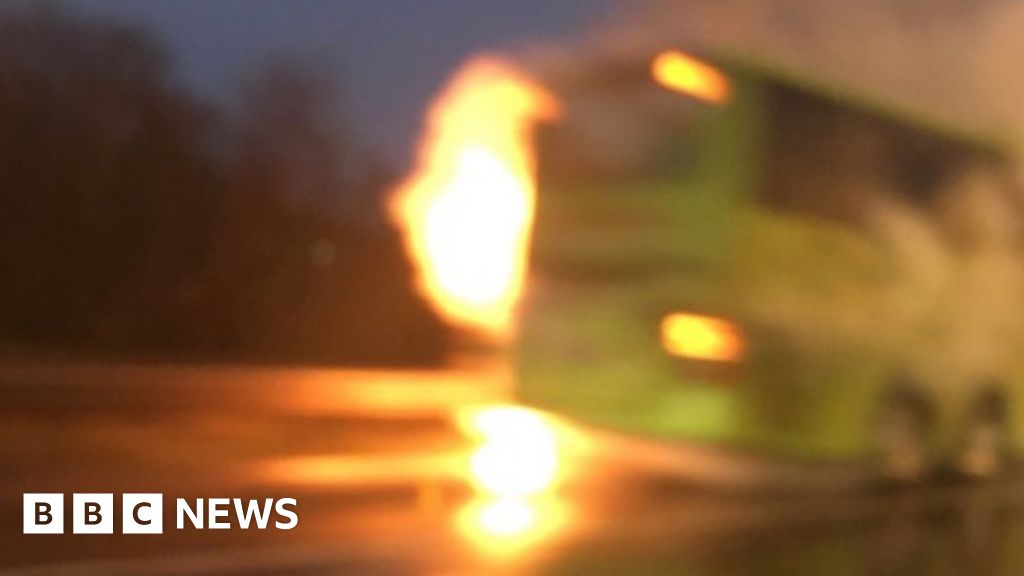 Coach catches fire on M1 outside Belfast - BBC News