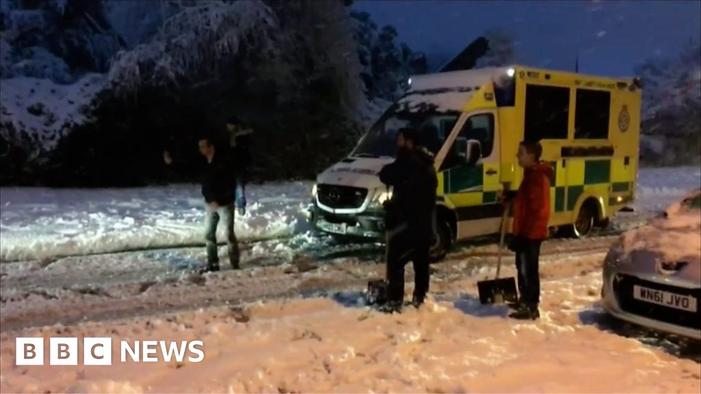 UK weather: Ambulance rescued from snow - BBC News