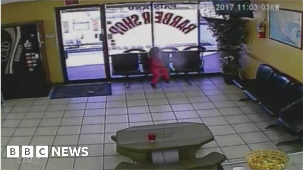 Girl narrowly escapes barbershop gunfire - BBC News