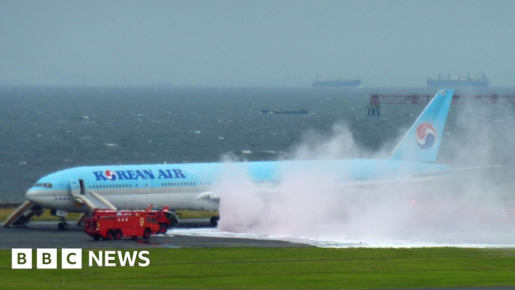 Korean Air plane catches fire on Haneda runway, Tokyo - BBC News