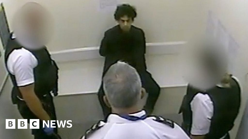 Footage shows arrest and detention of a man accused of shooting police ...