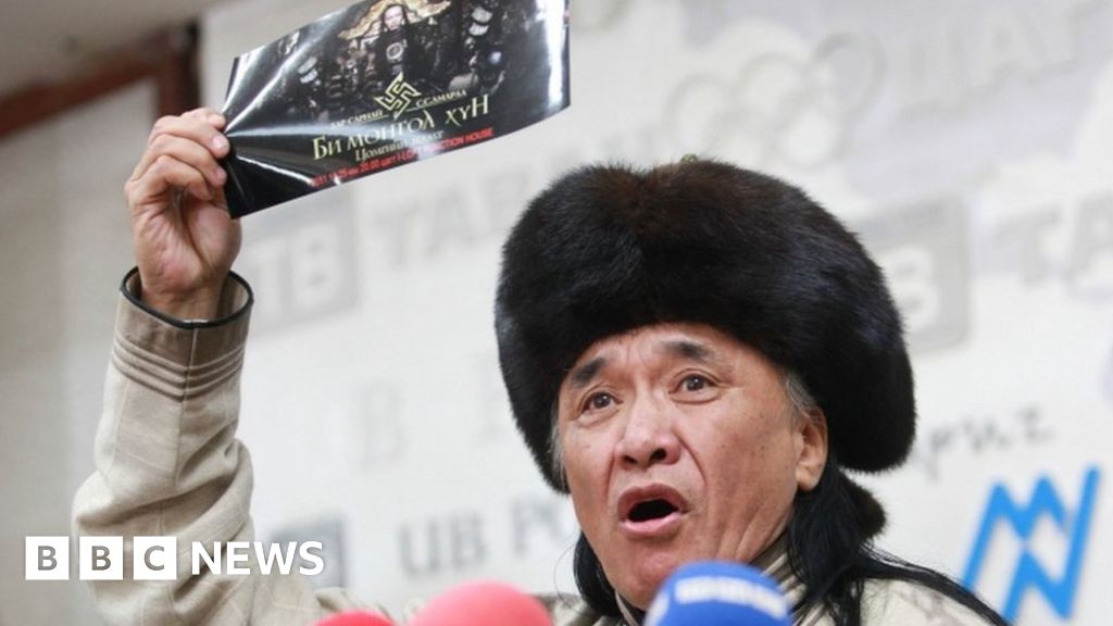 Russian diplomat 'beat Mongolian rapper over Swastika outfit' - BBC News