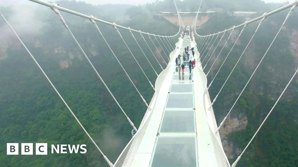 China's giant glass bridge hit with sledgehammer - BBC News