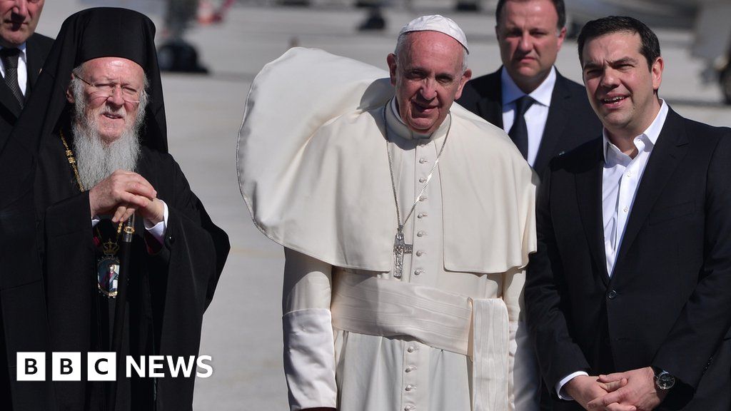 Pope arrives for migrant camp visit - BBC News