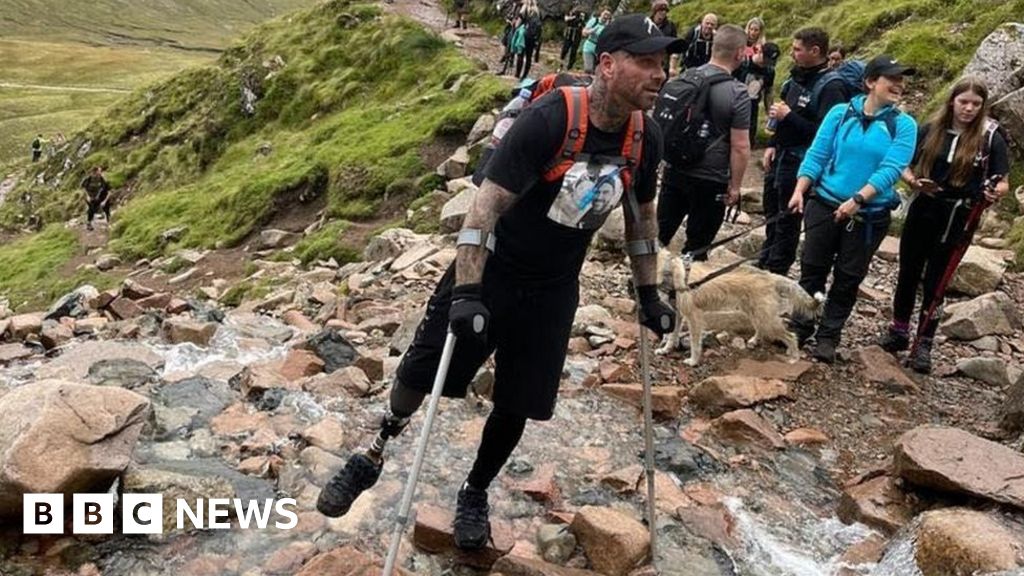 Ben Nevis: Amputee completes climb for children's holiday camp - BBC News