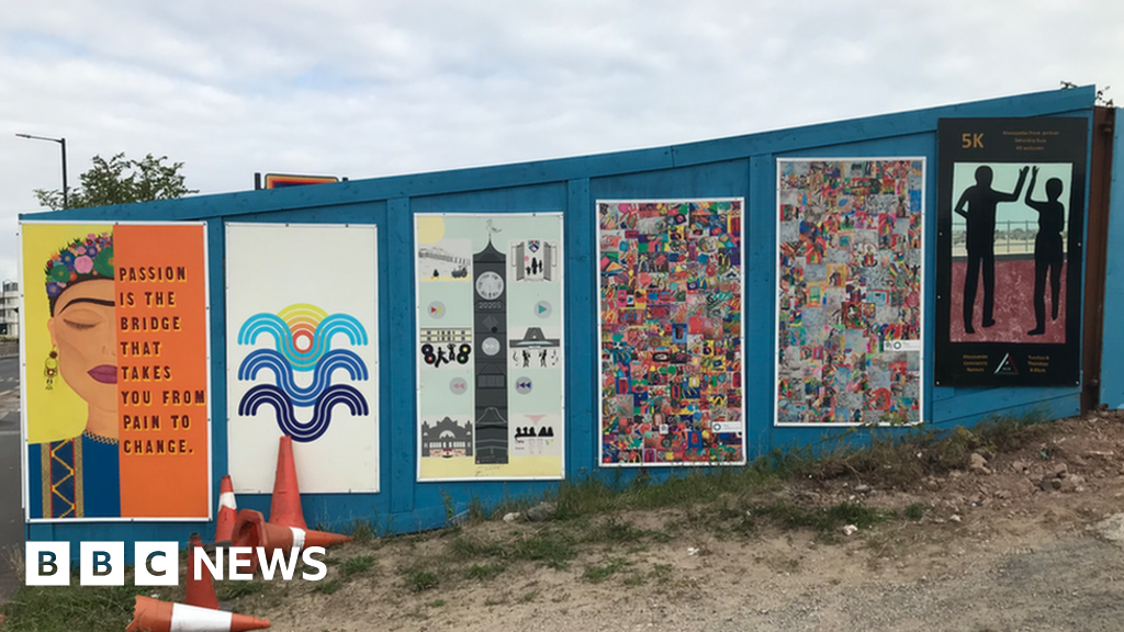 Morecambe artists add murals to ex-Frontierland site fence - BBC News