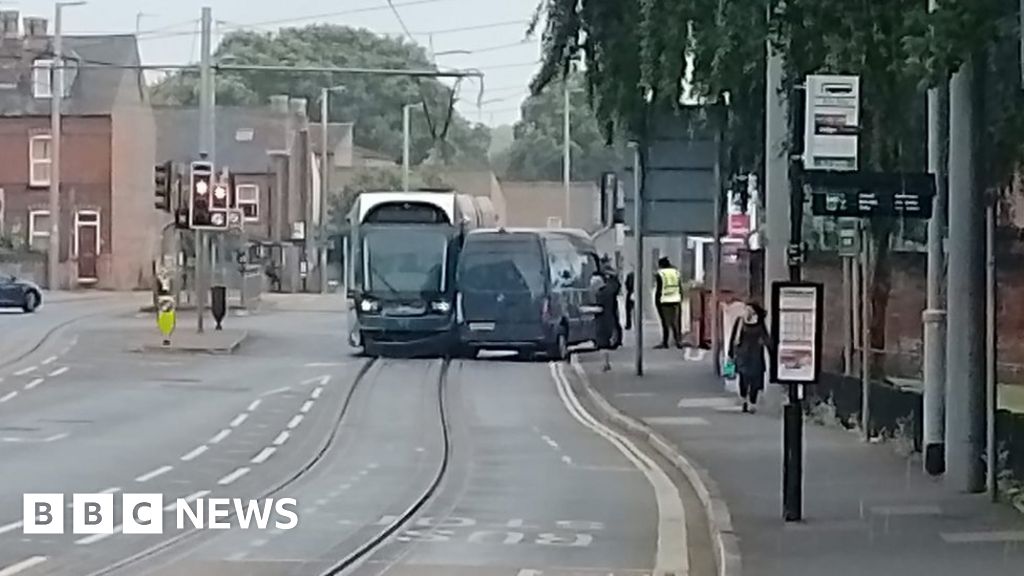 Crash between Amazon van and tram causes delays - BBC News