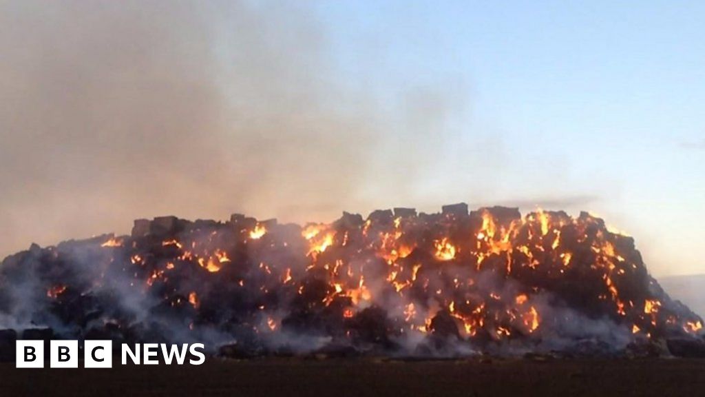 Fire in 1,500 tonne straw stack 'set to burn for a week' - BBC News