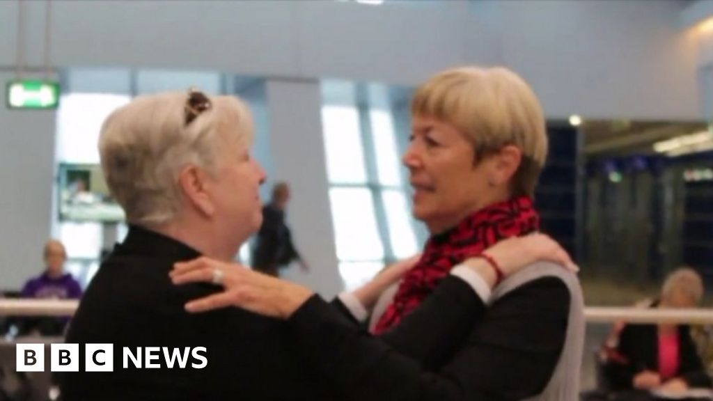 Sisters have emotional first meeting after 64 years apart - BBC News