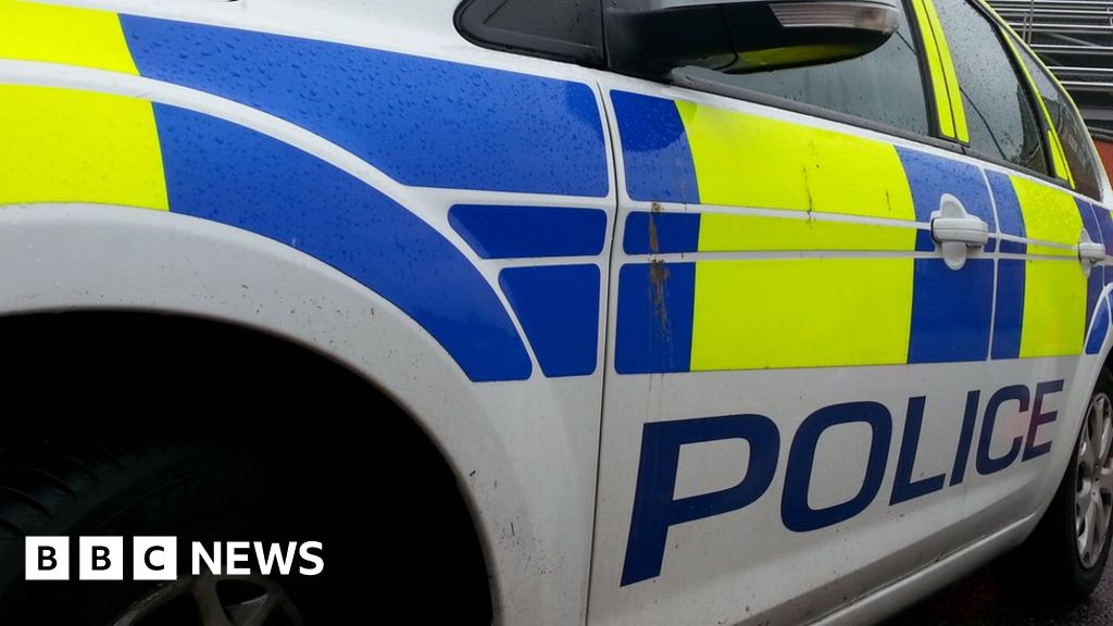 Man held after woman's body found in Bristol road - BBC News