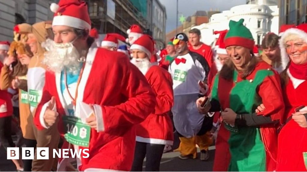 Hundreds of people dressed as Santa dash through Douglas for charity ...