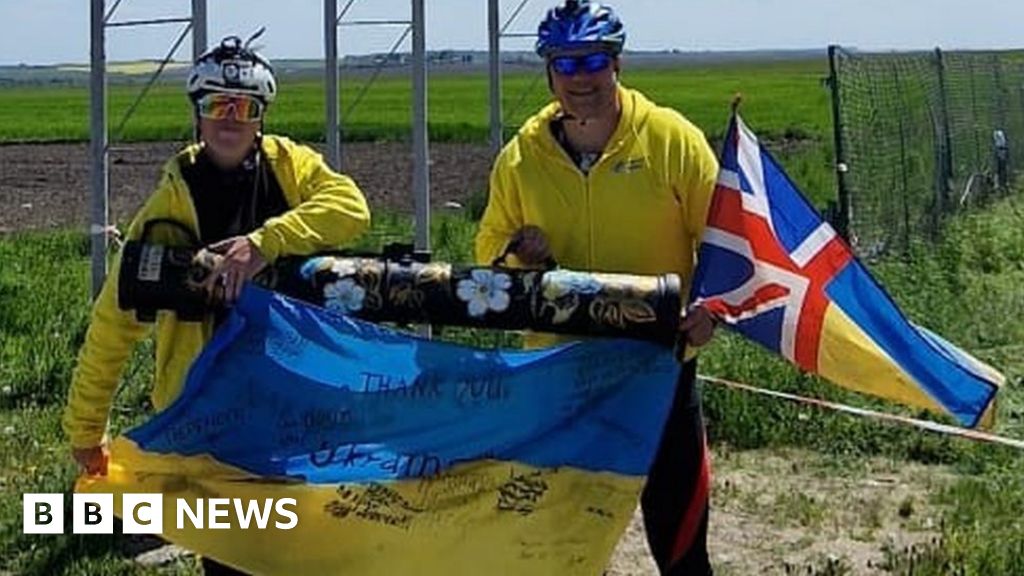 Pair cycle 1,850 miles from Dorset to Ukraine for children - BBC News