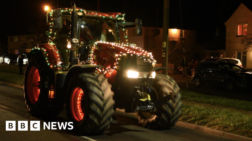 Festive tractor parade lights up Suffolk roads for charity - BBC News
