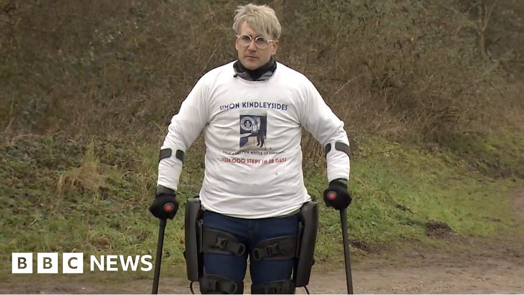NHS: Paralysed man walks in suit to 'keep others alive'