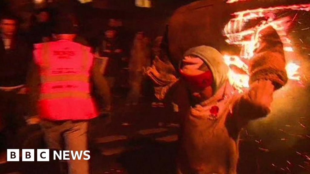 Thousands turn out to watch blazing barrels carried through streets ...