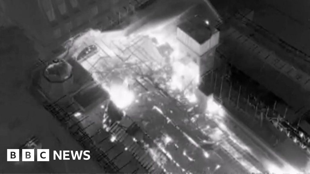 Drone footage of Manchester fire shows flames in the roof - BBC News