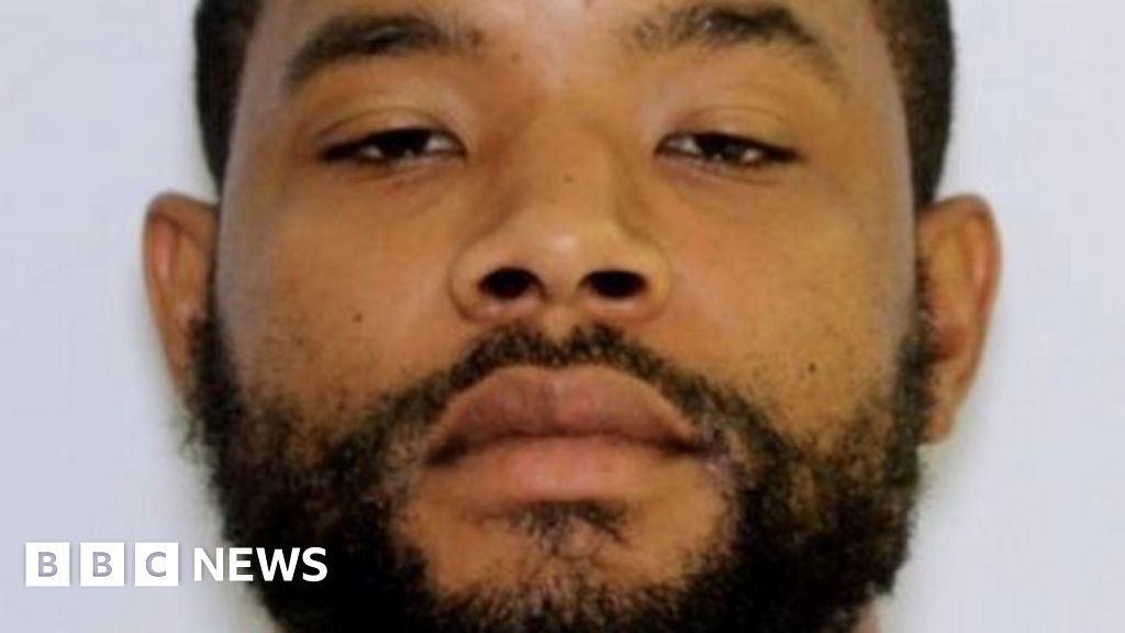 US suspect caught puffing cigar after mass shooting